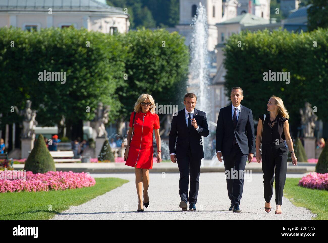 French President Emmanuel Macron (2ndL) and his wife Brigitte Macron (L ...