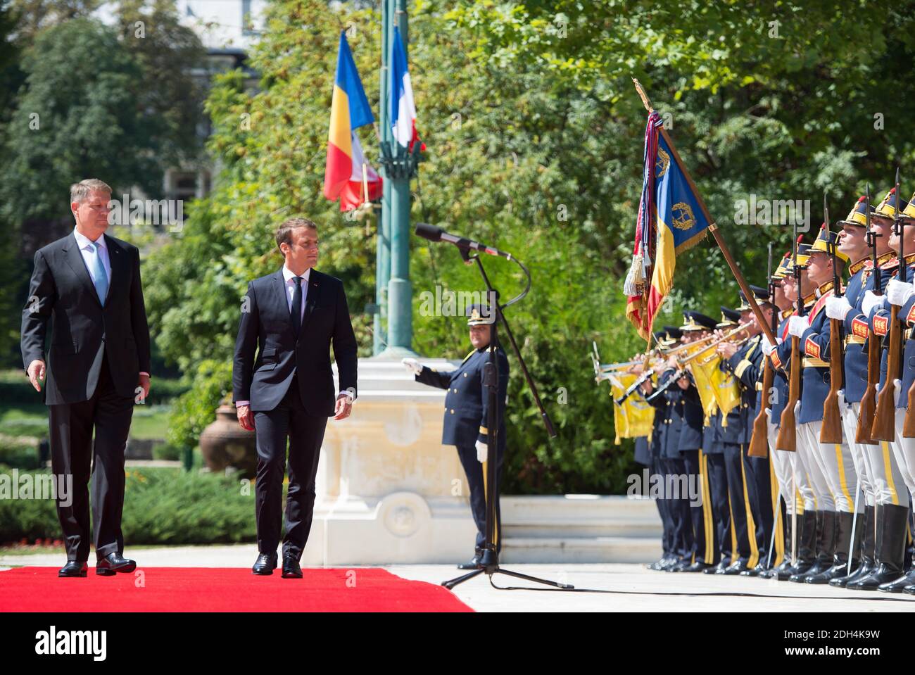 Romanian President Klaus Iohannis (L) and French President Emmanuel ...