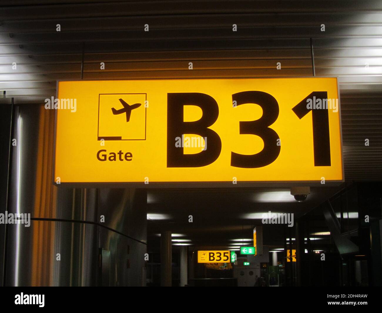 A sign is showing the gate number at Schiphol airport, Amsterdam ...