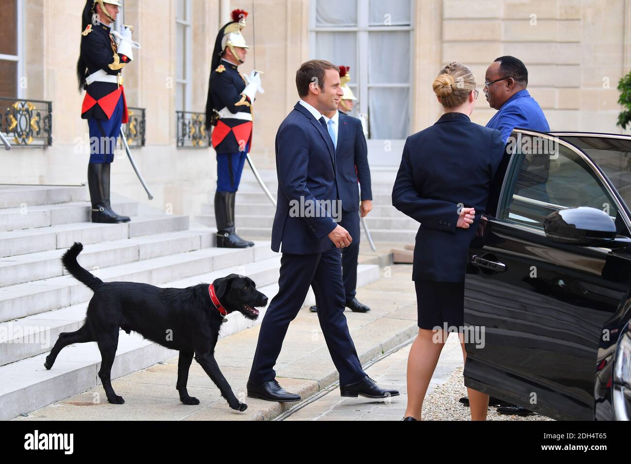 French president Emmanuel Macron, flanked by his dog named Nemo ...