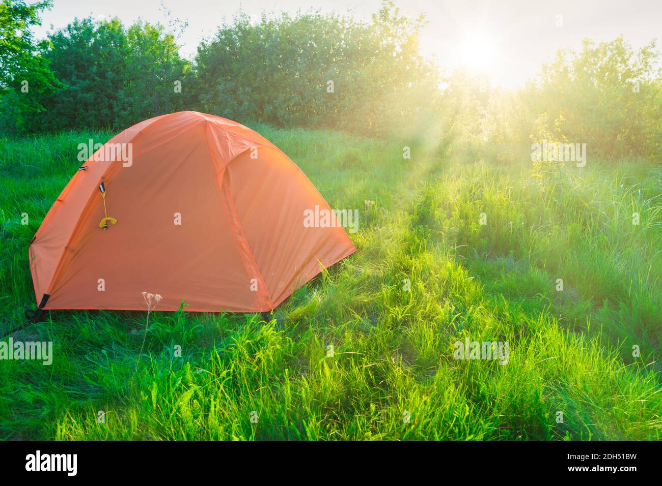 Tent camping at sunset Stock Photo - Alamy