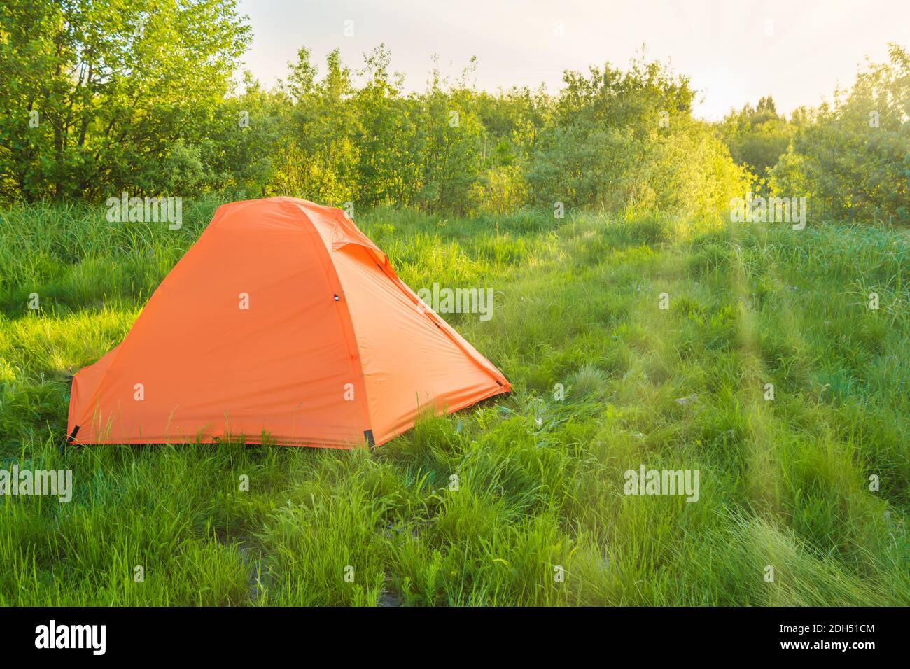 Tent camping at sunset Stock Photo - Alamy
