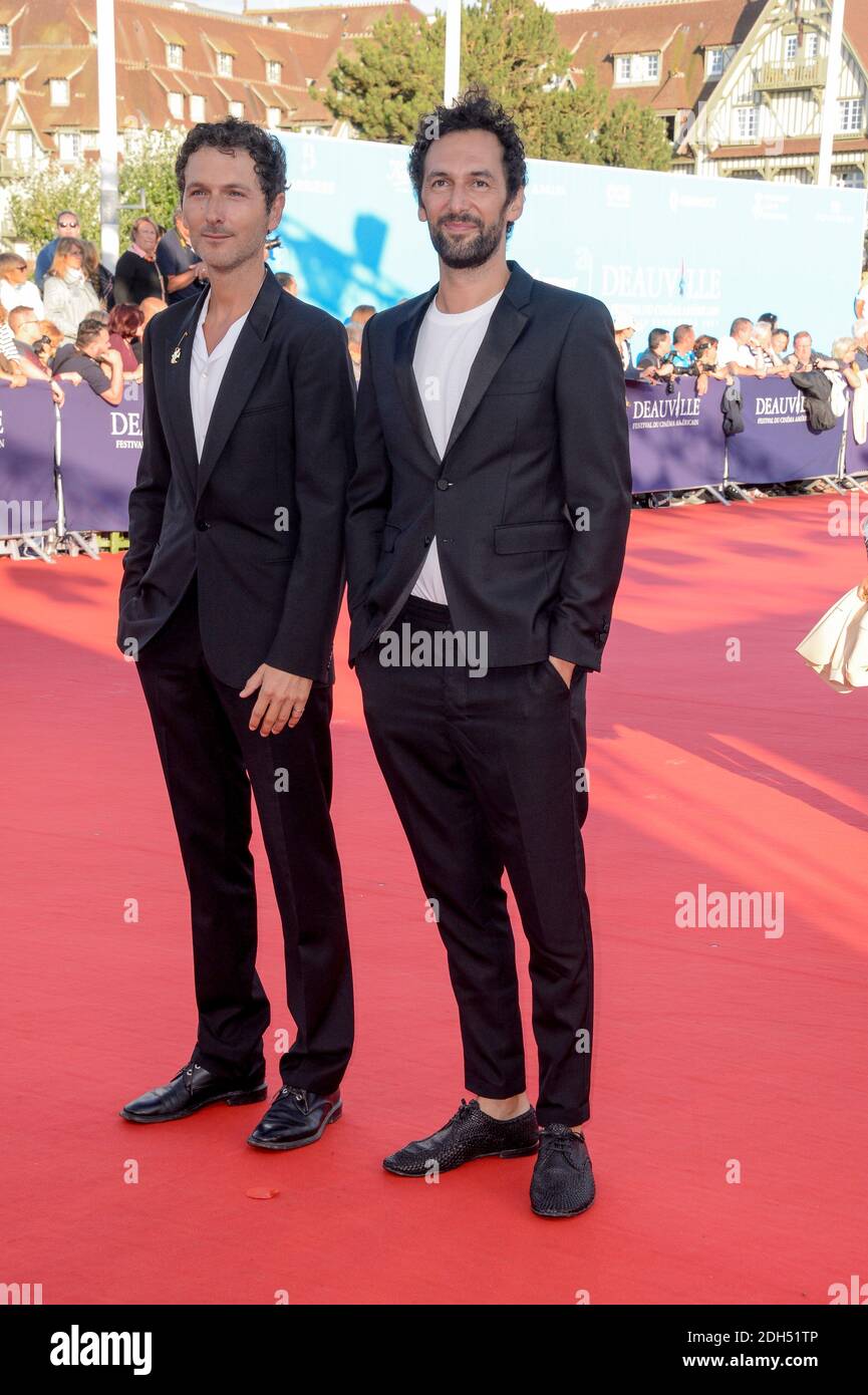 Olivier Coursier and Simon Buret from Aaron band attending the opening ...