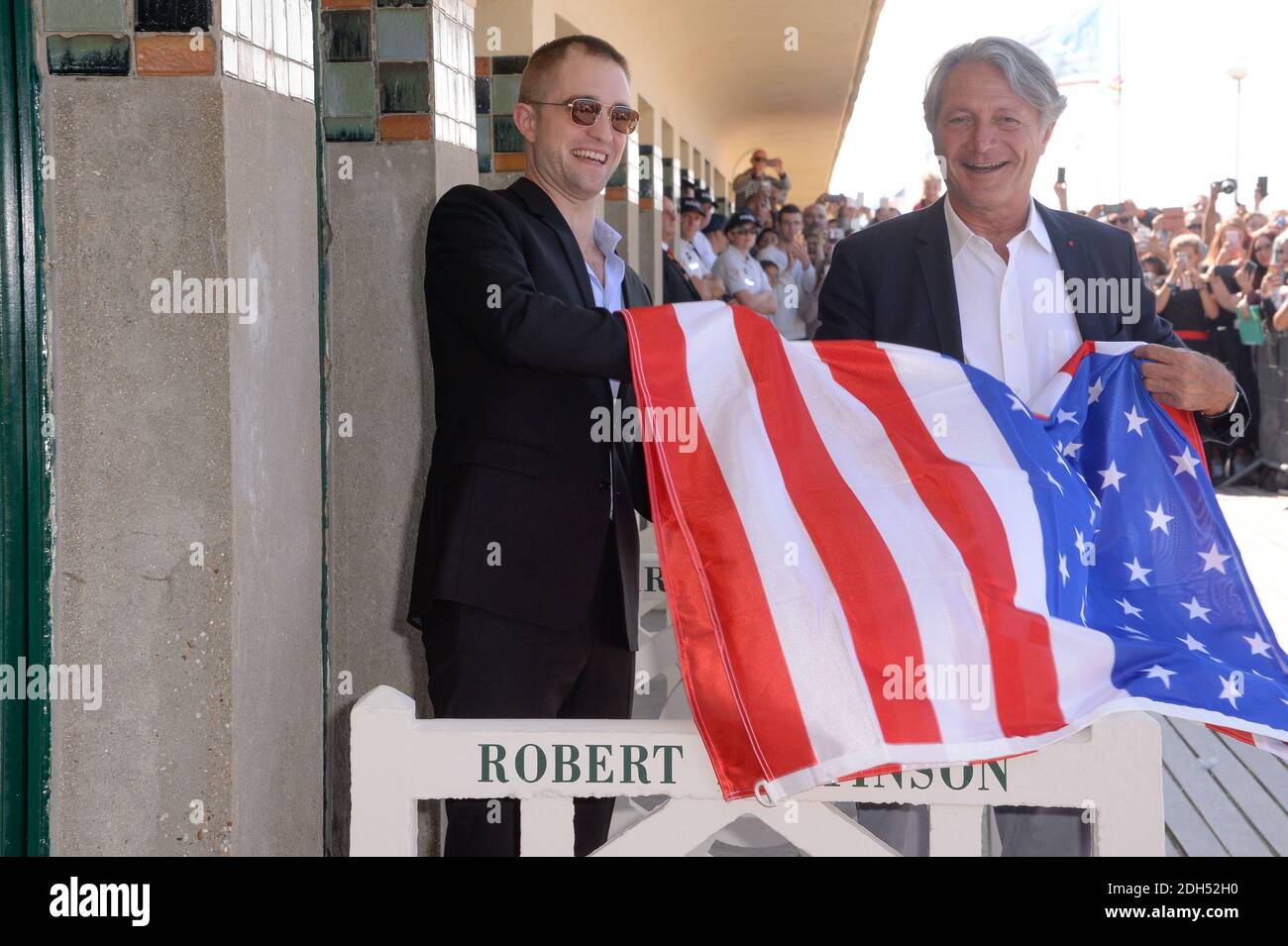 Robert Pattinson and mayor Philippe Augier attending a photocall at the ...