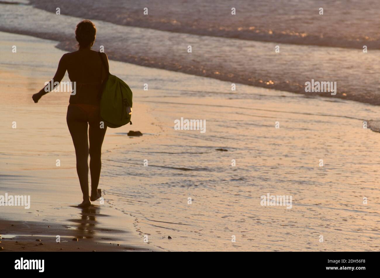 backlight scenes with yellow and orange sunset on the beach Stock Photo ...