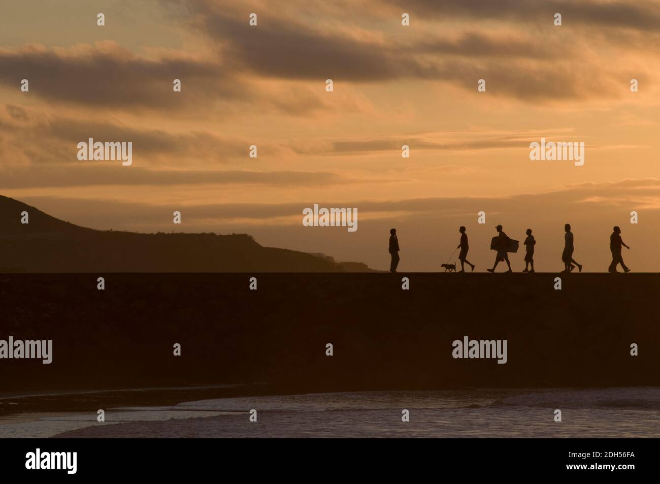 backlight scenes with yellow and orange sunset on the beach Stock Photo ...