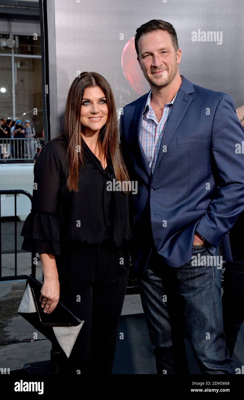 Tiffani Thiessen and Brady Smith attend the premiere of IT at TCL ...
