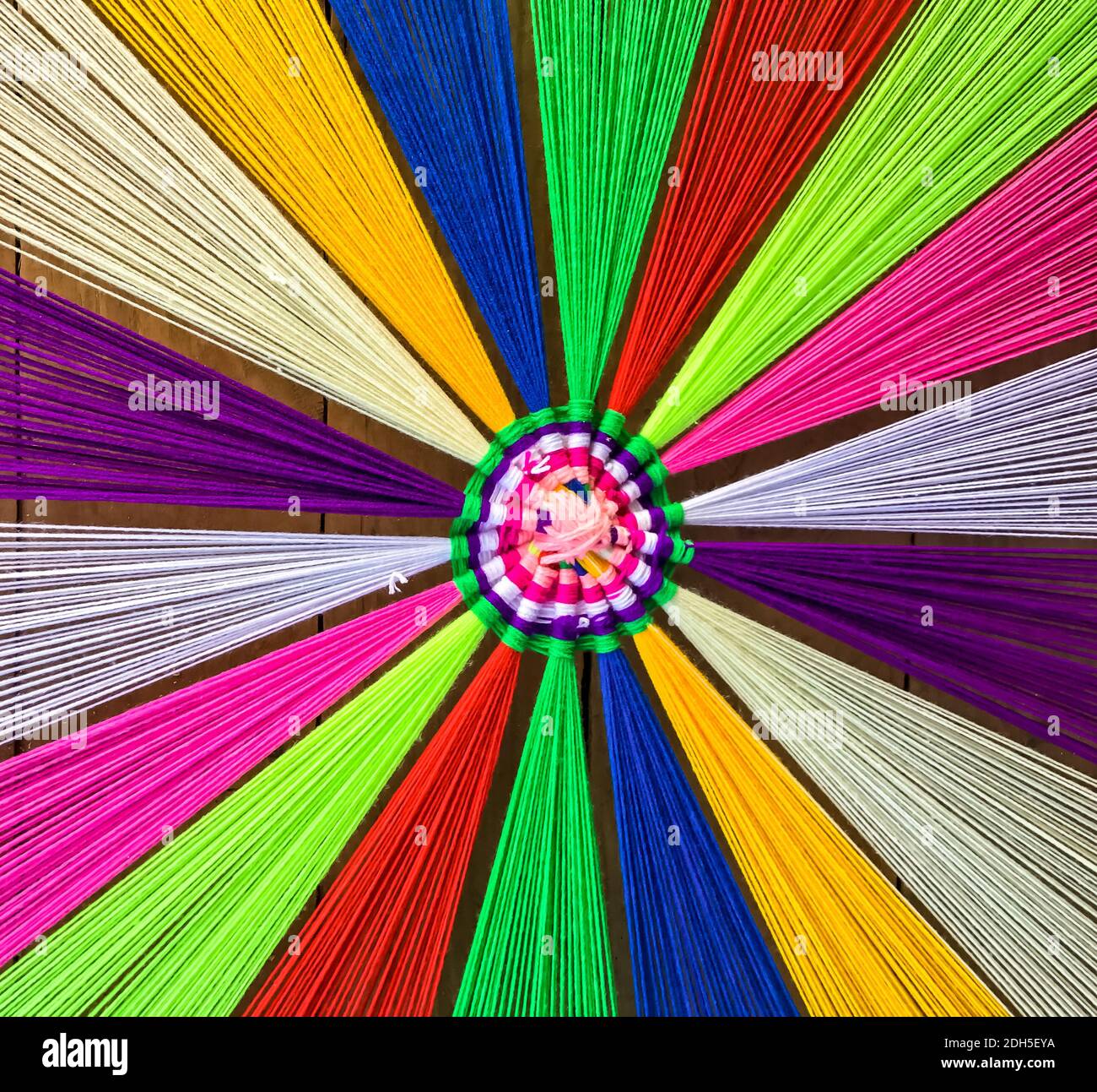 Various colored threads on wooden floor for decoration Stock Photo - Alamy