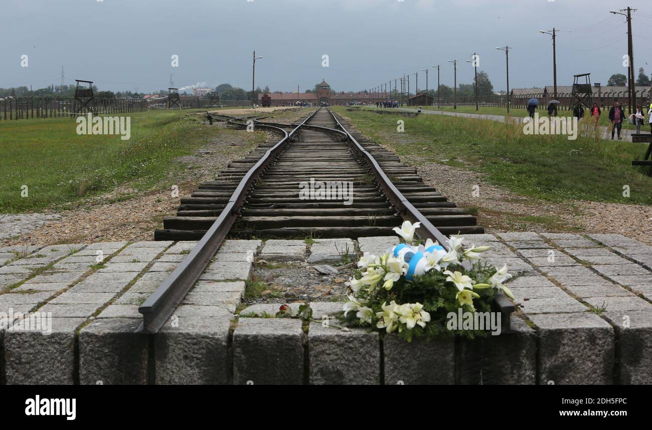 Commemorative flowers on the rail track in Auschwitz II-Birkenau Nazi ...