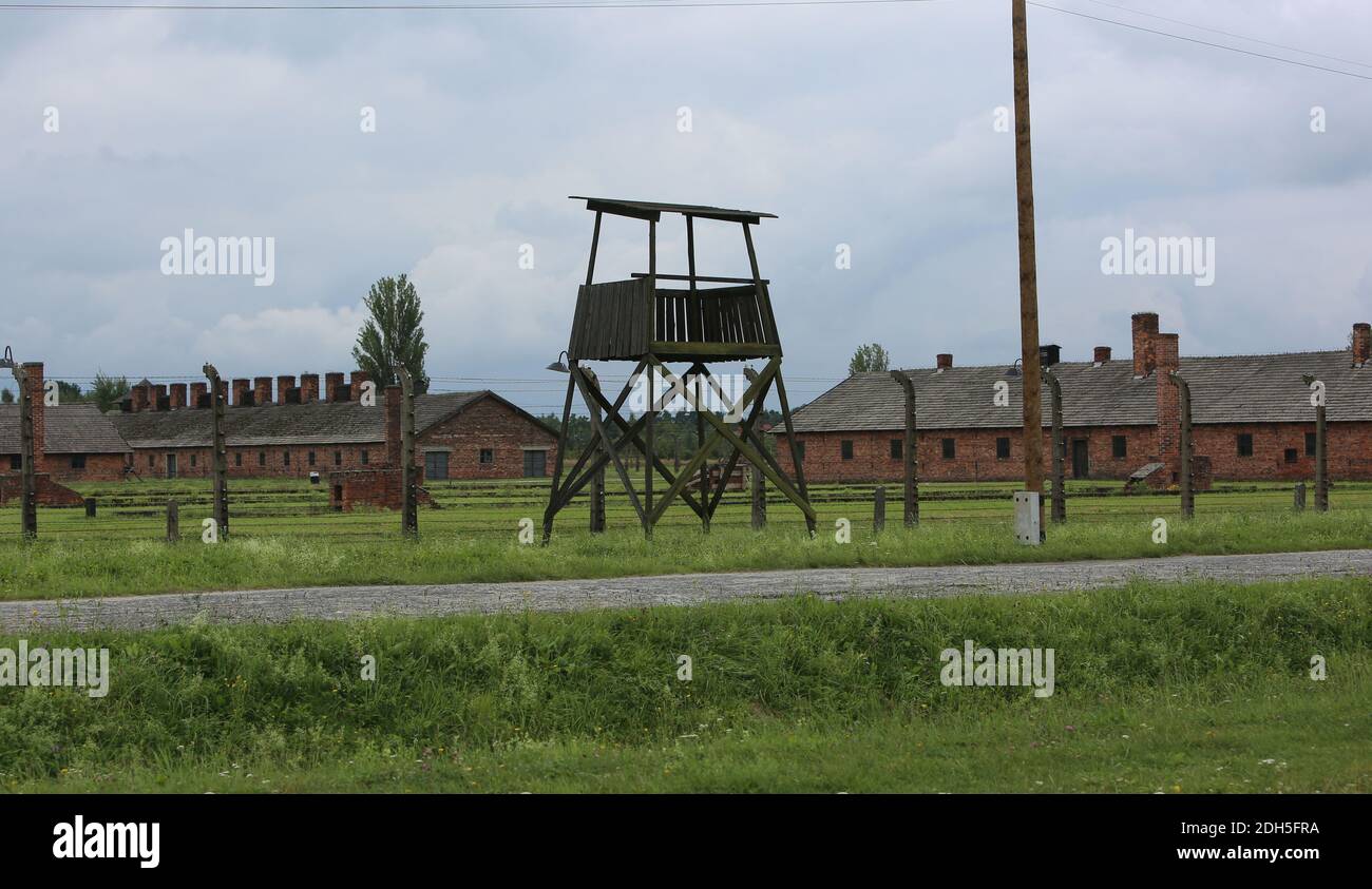 A guard tower and barracks at the Auschwitz-Birkenau Nazi concentration ...
