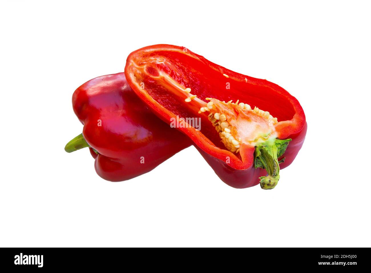 Half and whole red bell pepper on white background Stock Photo - Alamy
