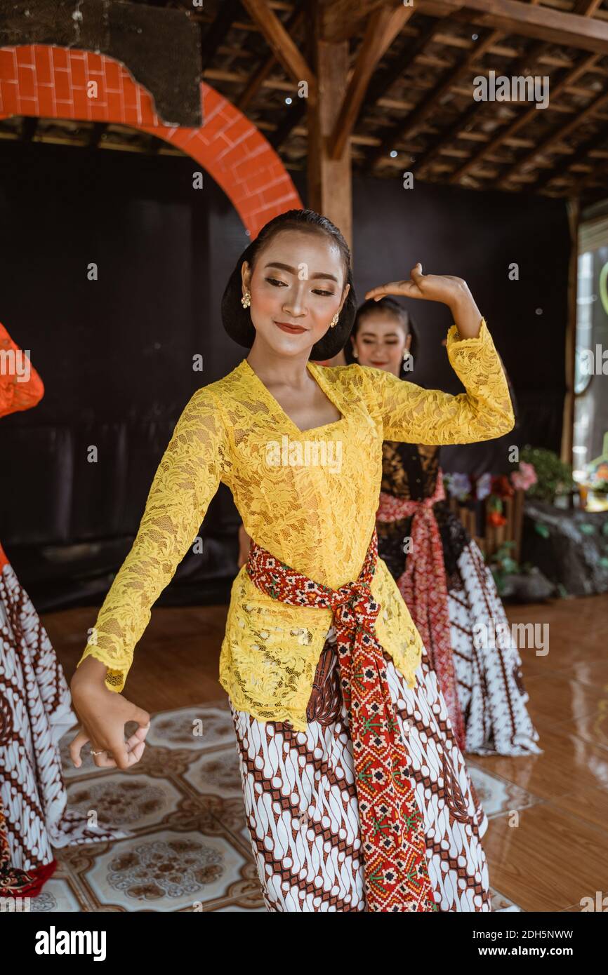 portrait young women presenting traditional Javanese dance movements ...