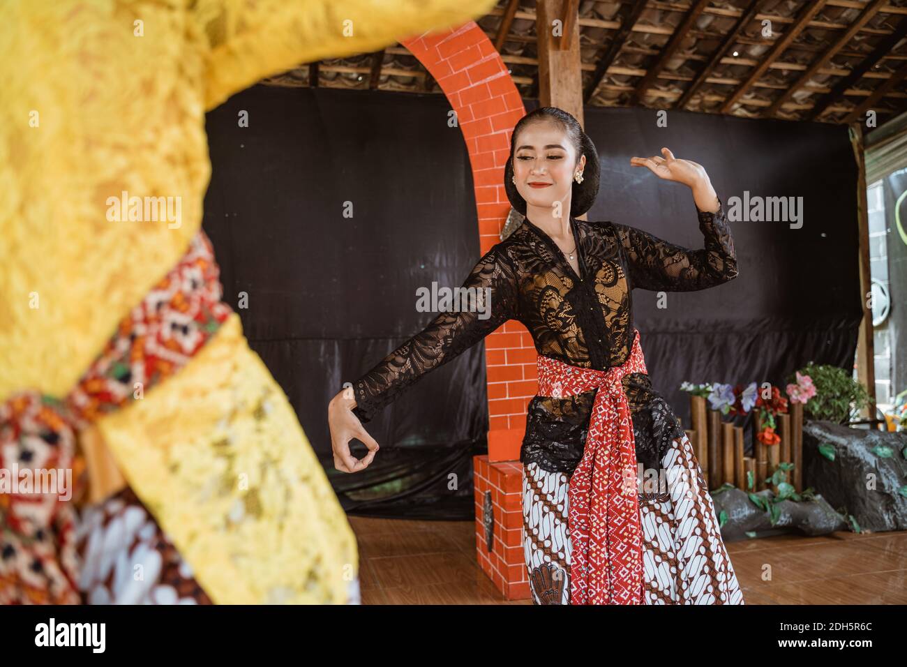 portrait young women presenting traditional Javanese dance movements ...