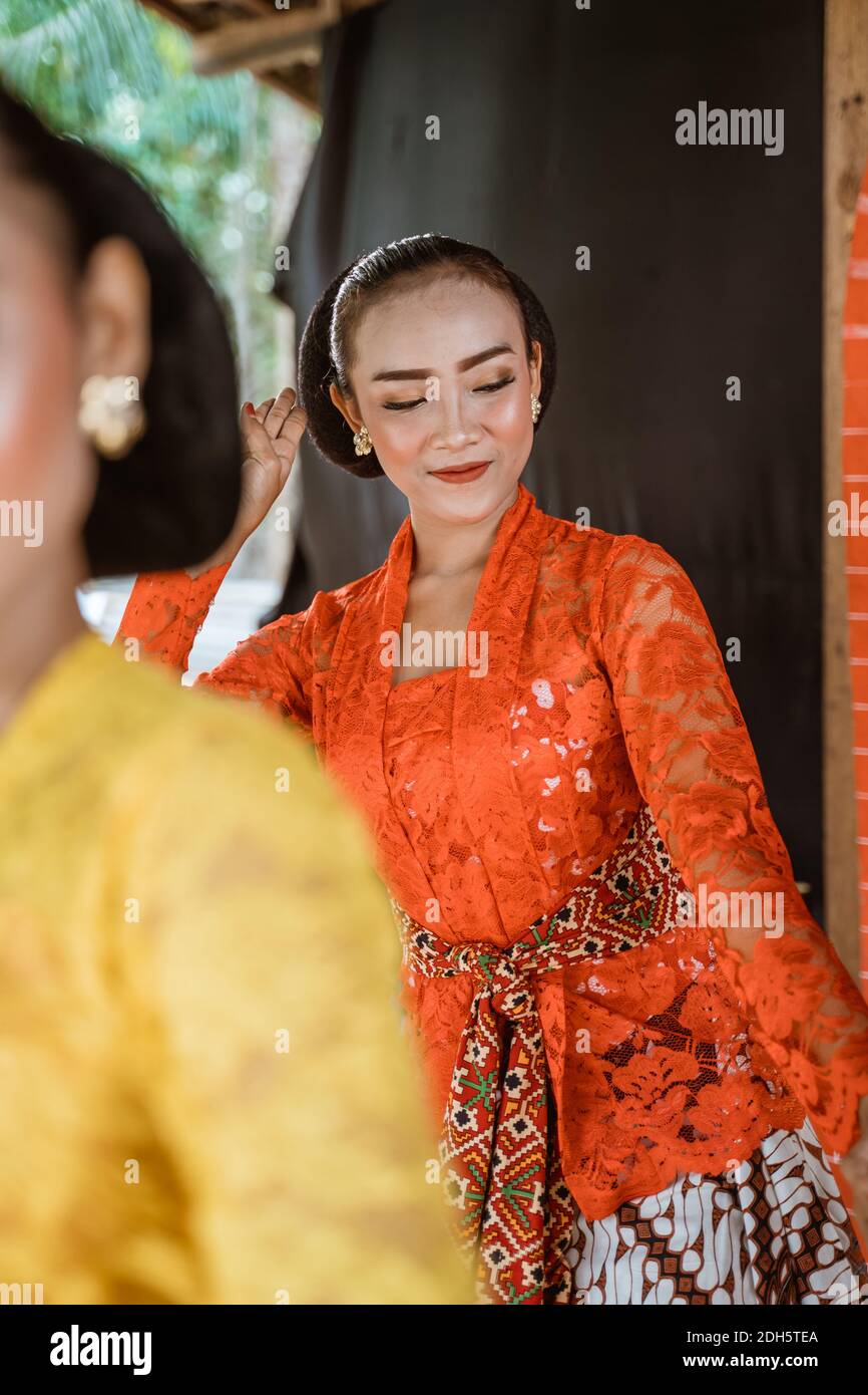 portrait young women presenting traditional Javanese dance movements ...