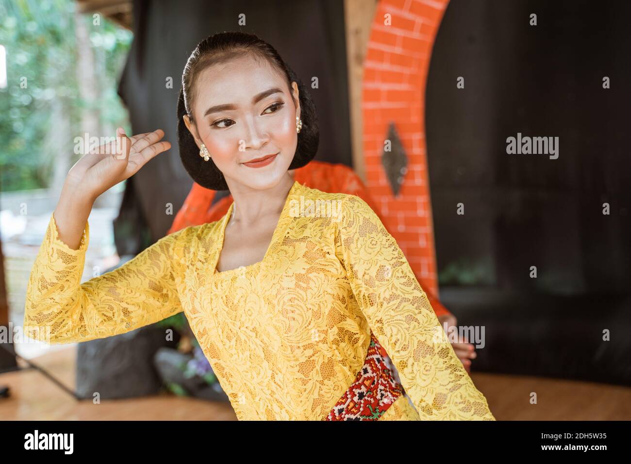 portrait young women presenting traditional Javanese dance movements ...