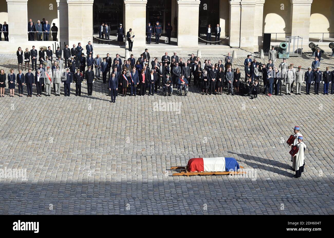 French President Emmanuel Macron, 2nd left, walks behind French ...
