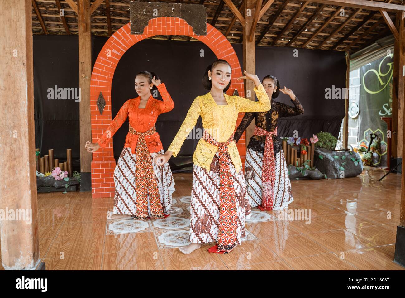 portrait of three young women presenting traditional Javanese dance ...