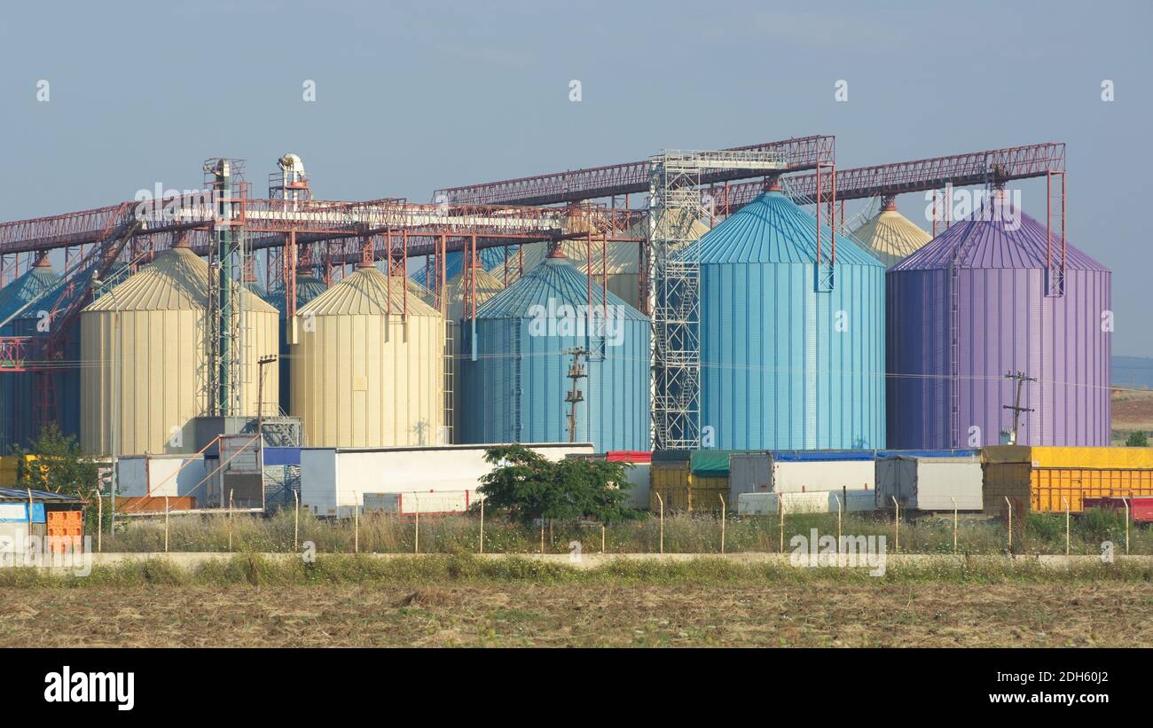 row of multi colored silos Stock Photo - Alamy