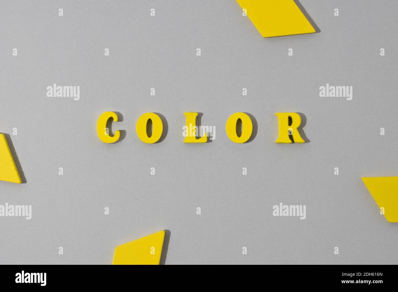 Abstract paper gray background with yellow wooden word Stock Photo - Alamy