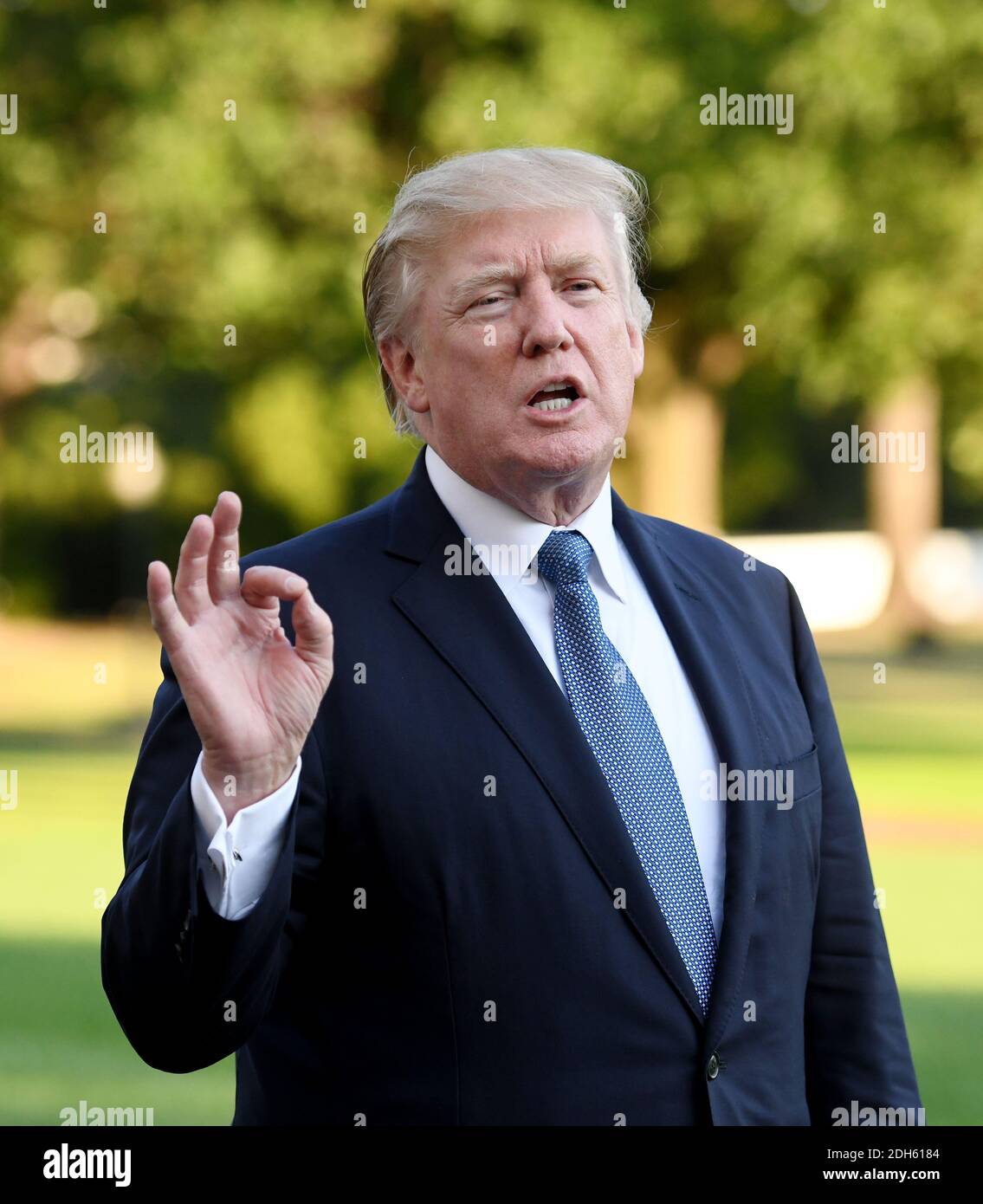 US President Donald Trump answers questions from the press after ...