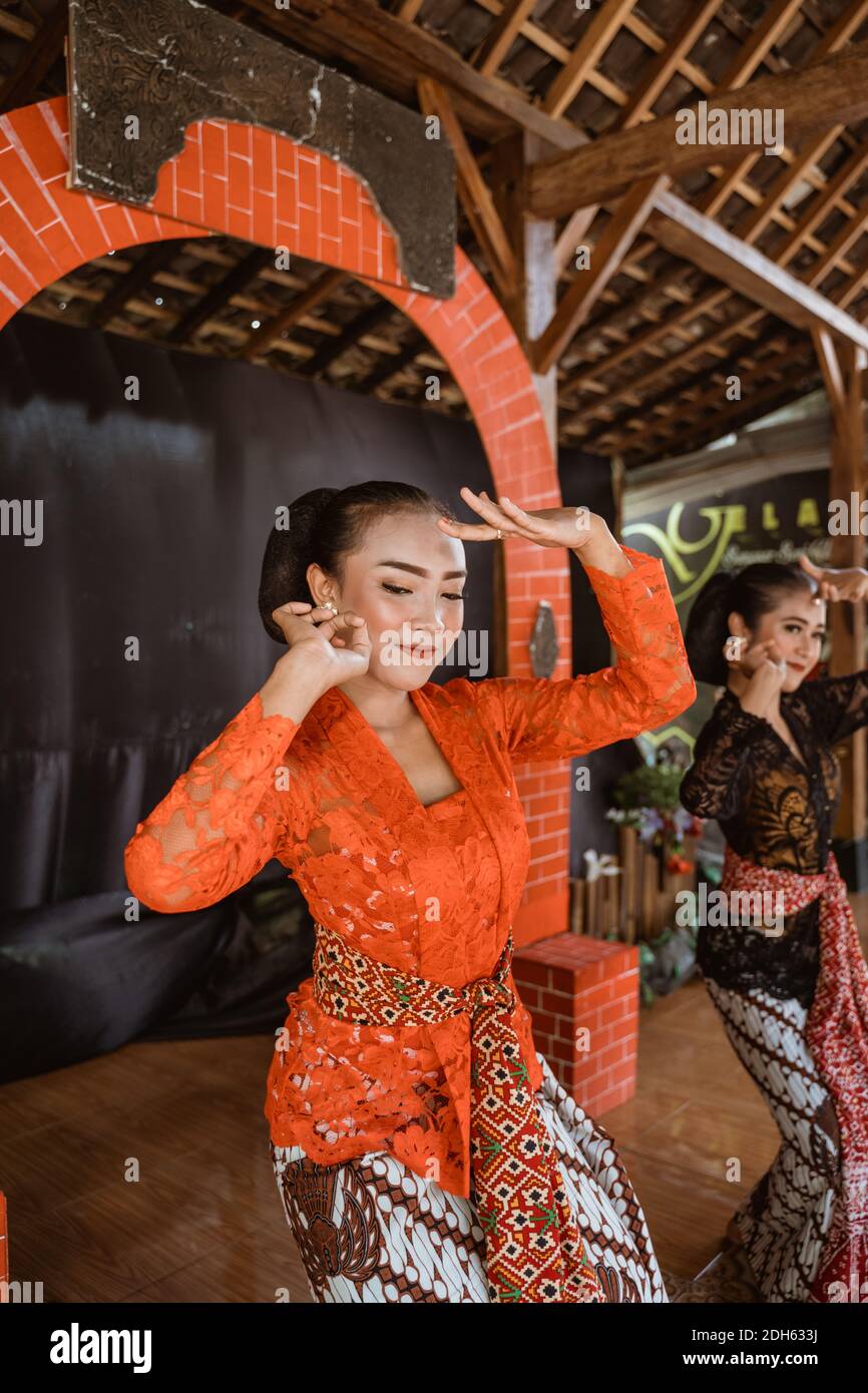 portrait young women presenting traditional Javanese dance movements ...