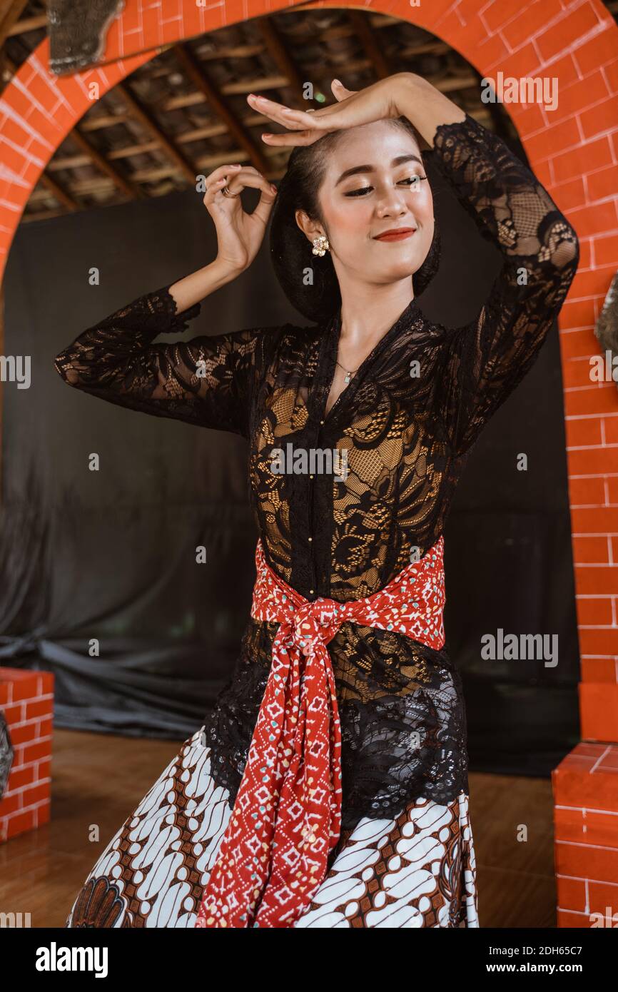 portrait young women presenting traditional Javanese dance movements ...