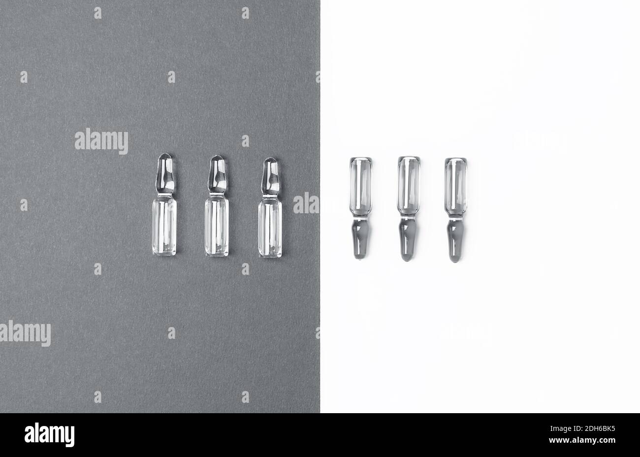 Line of ampules for injections on trendy grey and isolated white ...