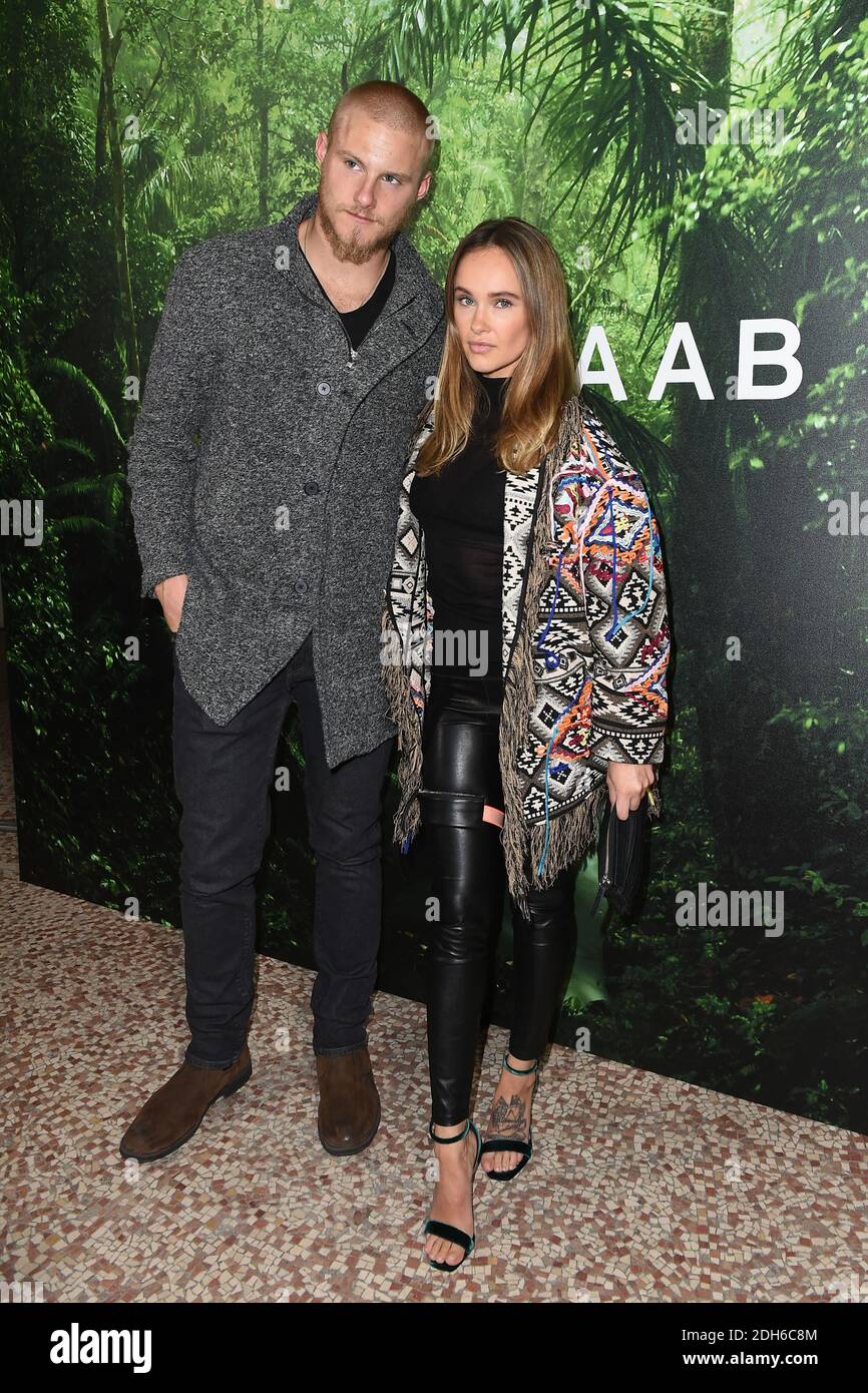 Alexander Ludwig and a guest attend the Elie Saab show as part of the ...