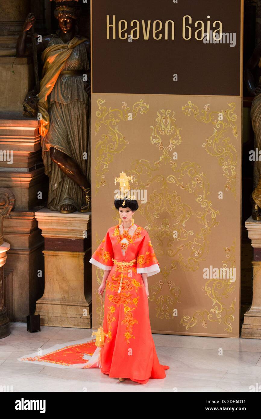 A models displays a creation designed by Ying Xiong on the runway ...