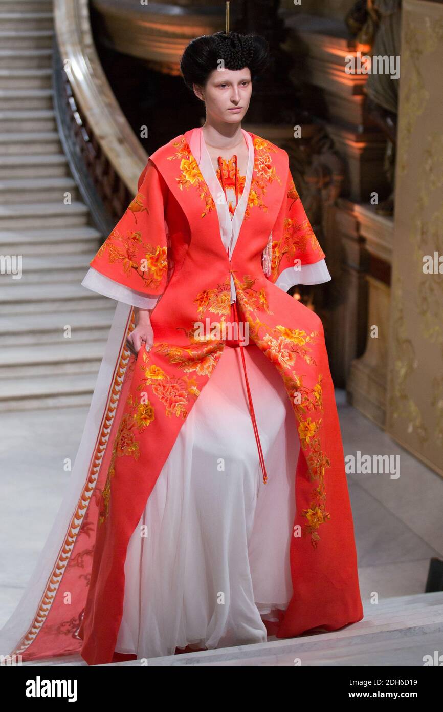 A models displays a creation designed by Ying Xiong on the runway ...
