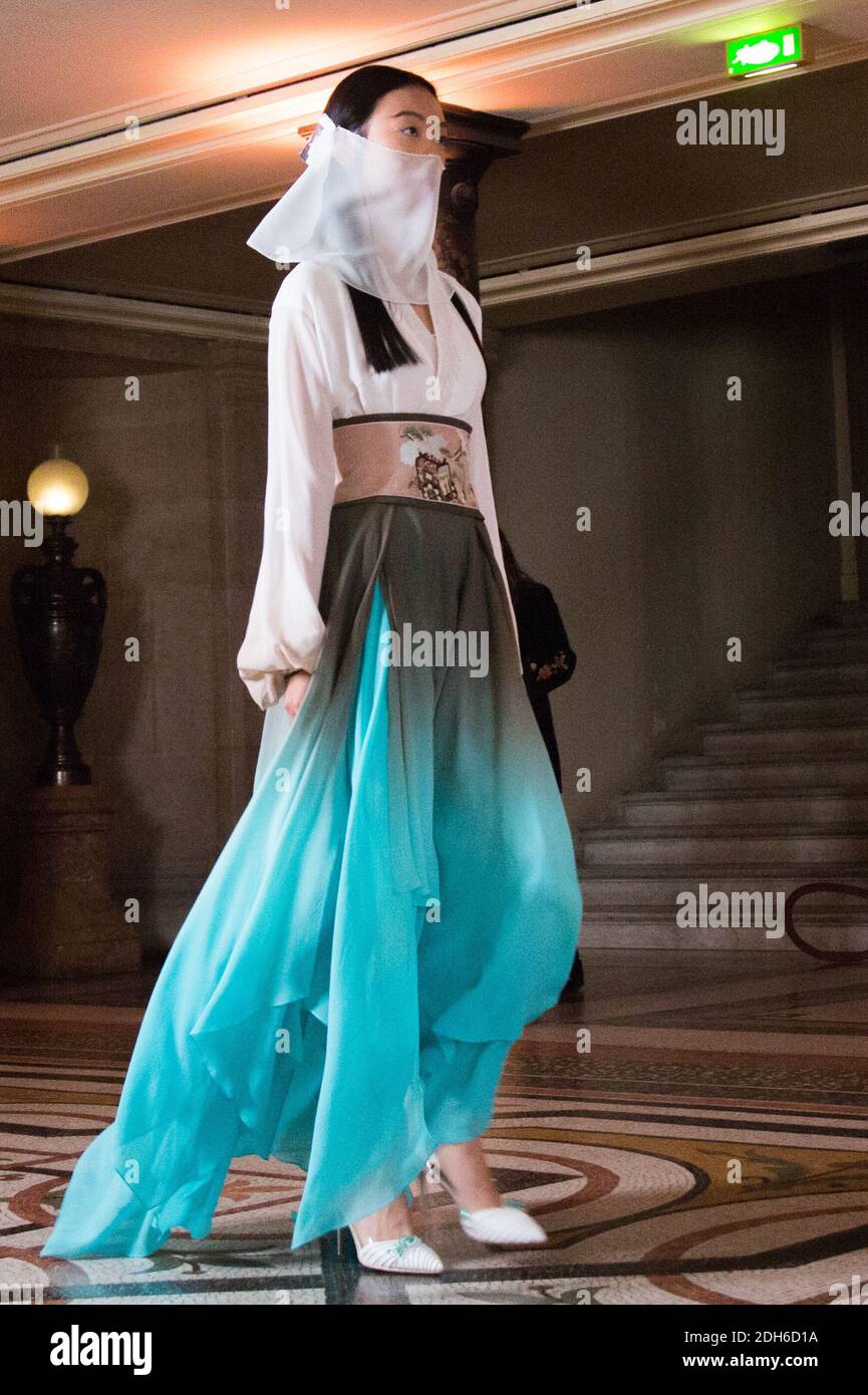 A models displays a creation designed by Ying Xiong on the runway ...