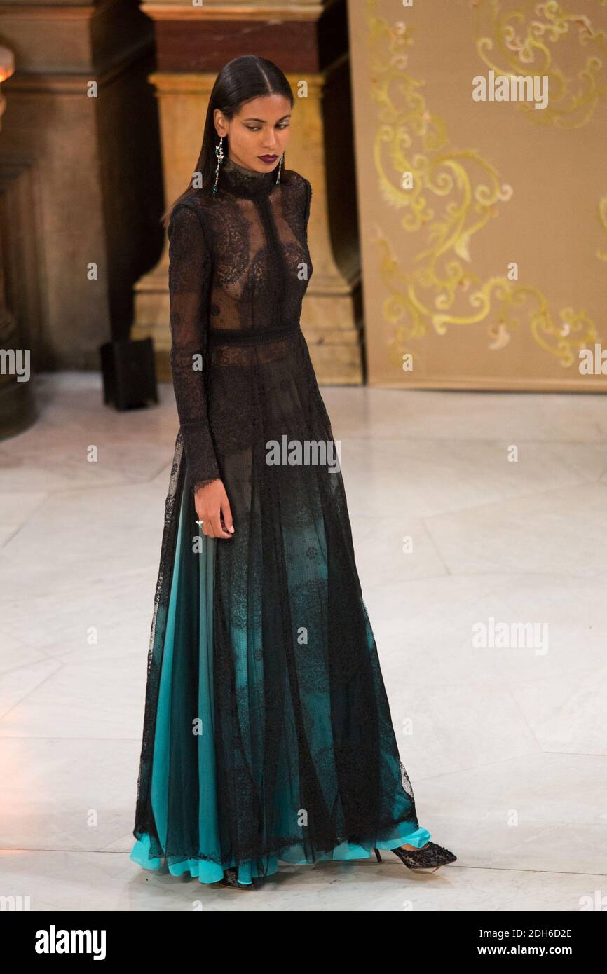 A models displays a creation designed by Ying Xiong on the runway ...