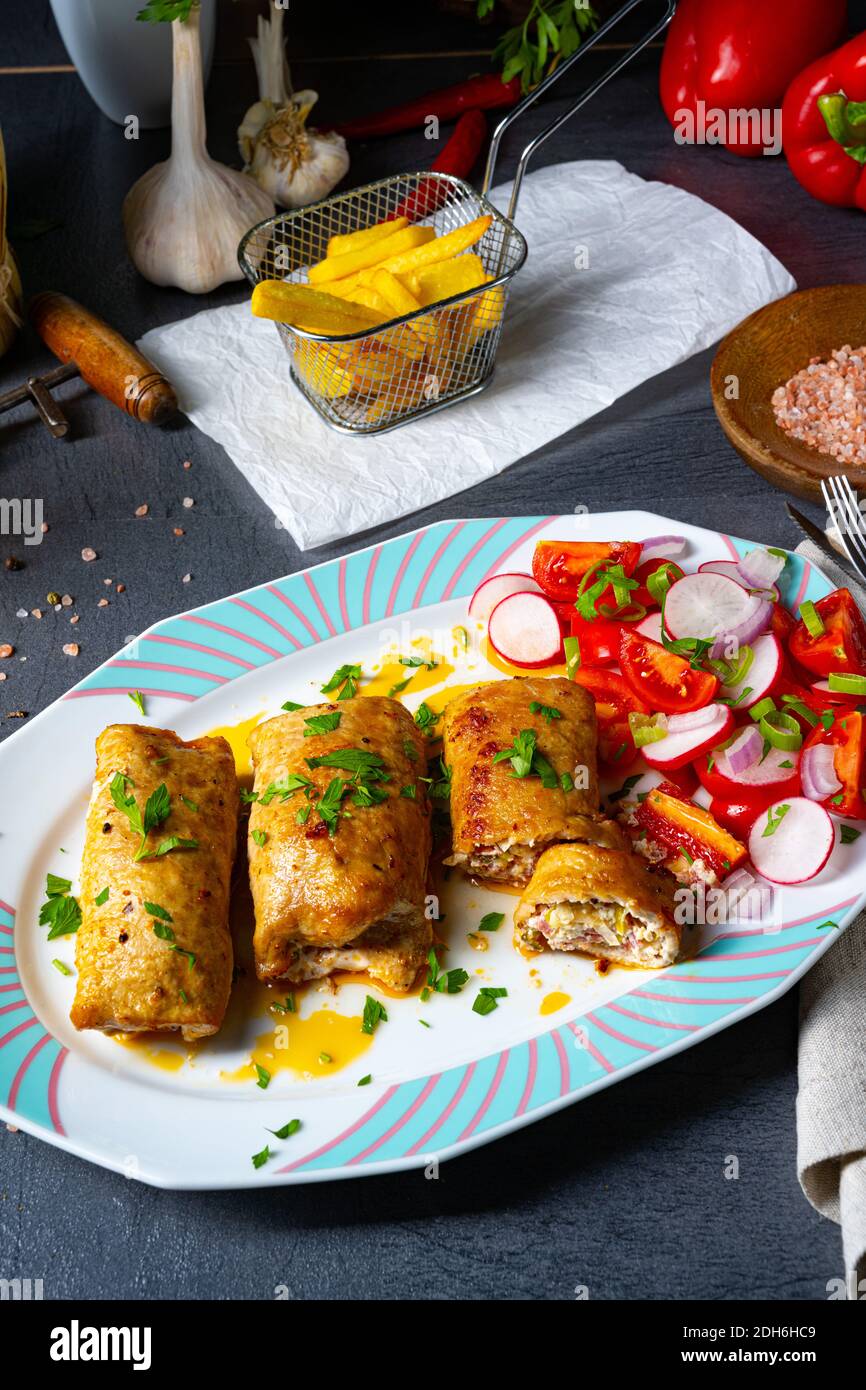 Vegetable roulade from roast pork loins with salads Stock Photo - Alamy