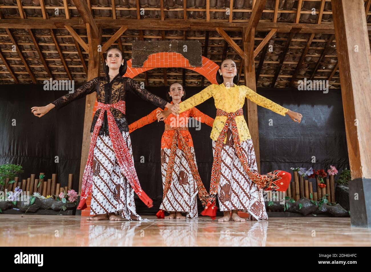 portrait of three young women presenting traditional Javanese dance ...