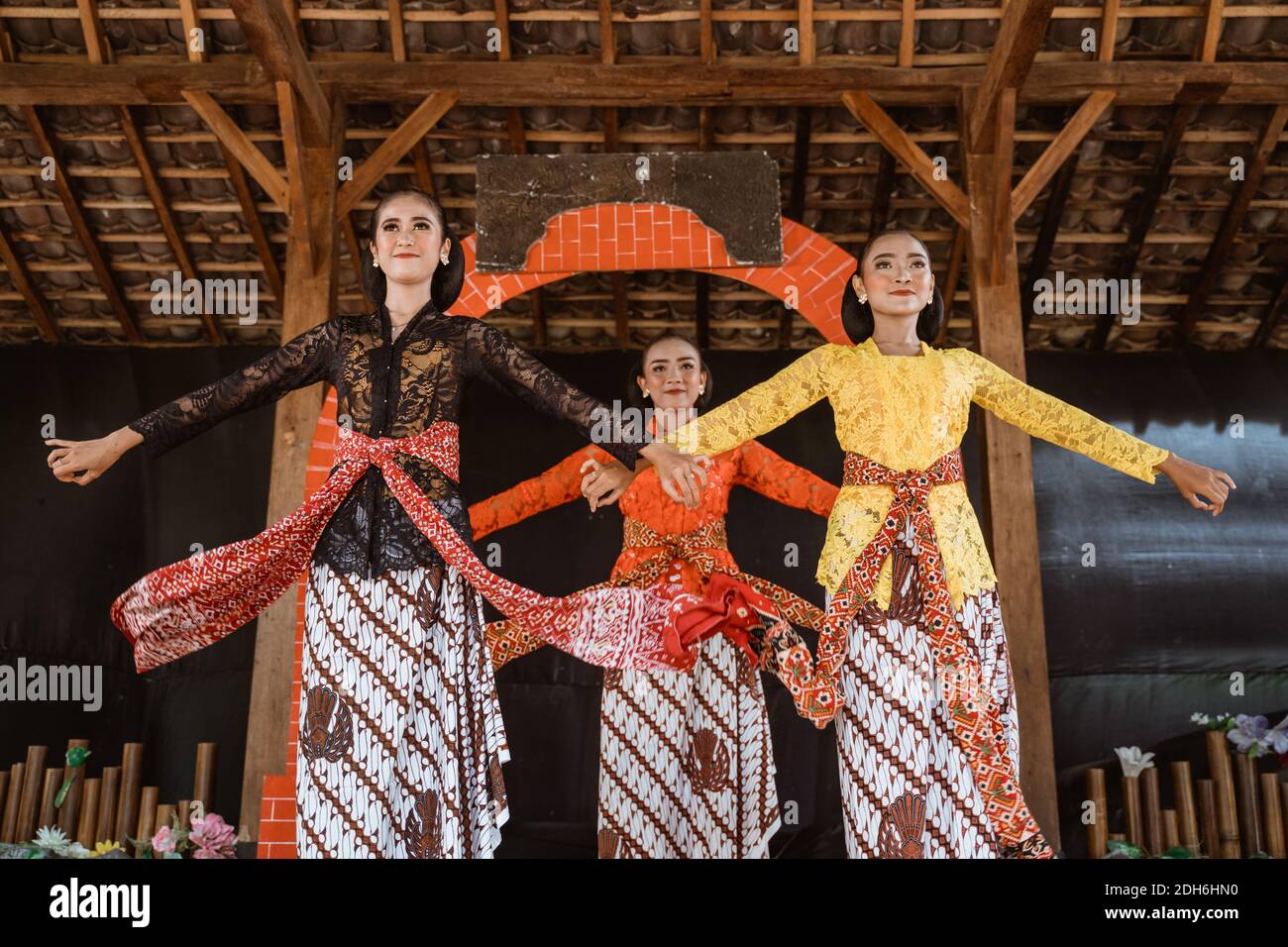 portrait of three young women presenting traditional Javanese dance ...