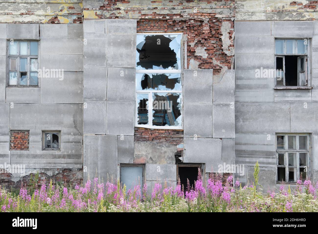 Old destroyed abandoned raw wooden house with the broken out windows ...