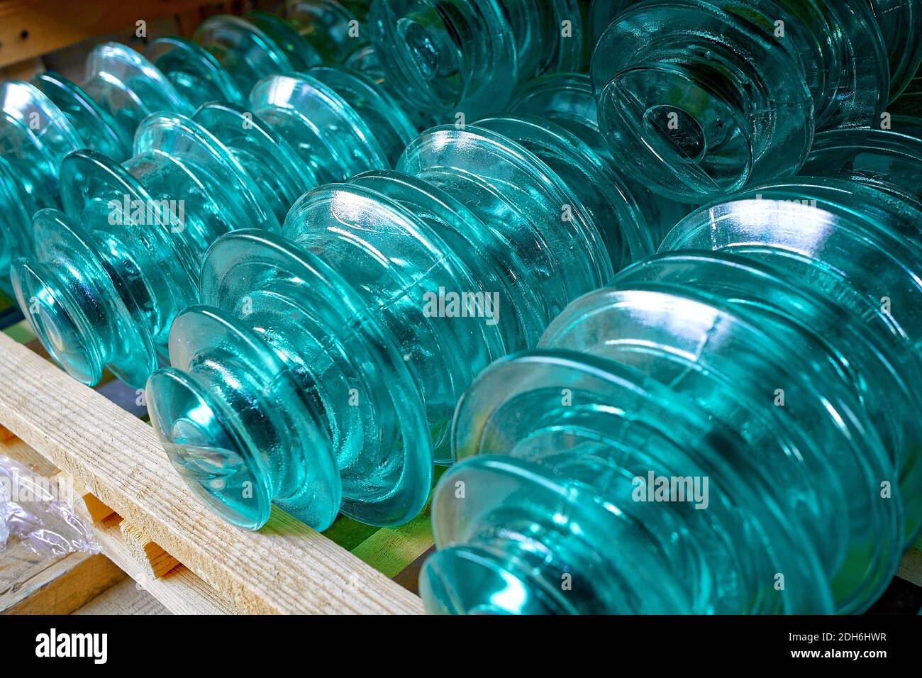 Glass insulators for high-voltage electric poles are on the shelf Stock ...