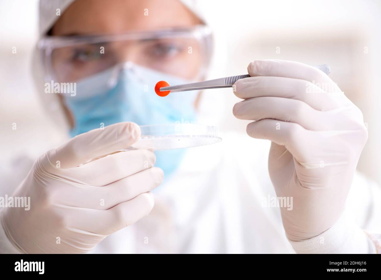Lab assistant in drug synthesis concept Stock Photo - Alamy