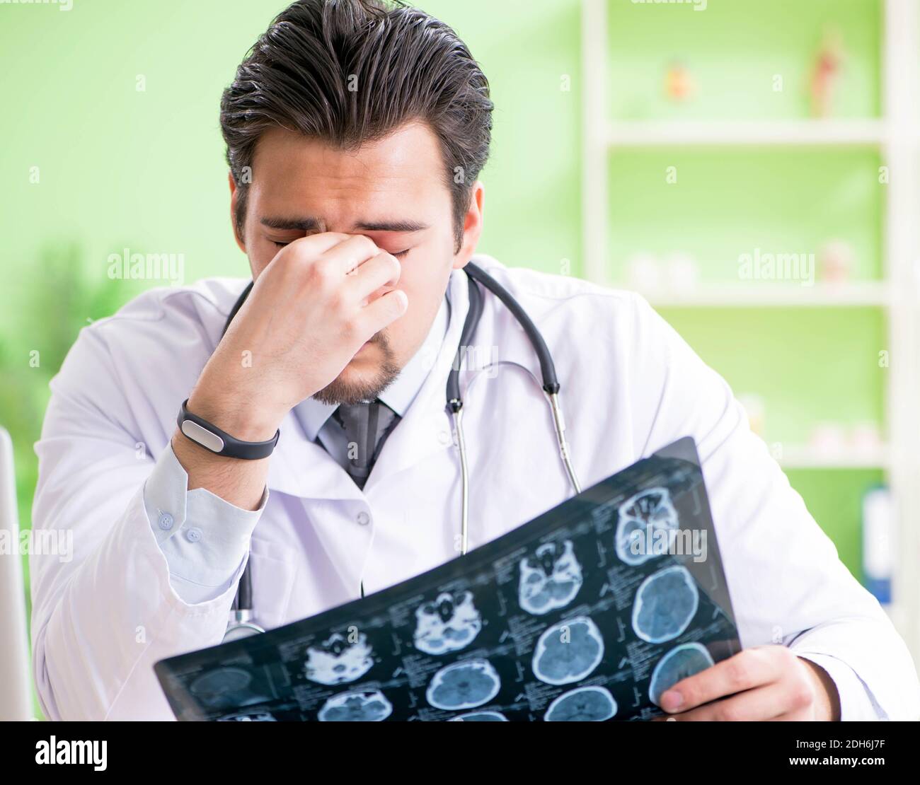 Doctor radiologist looking at x-ray scan in hospital Stock Photo - Alamy