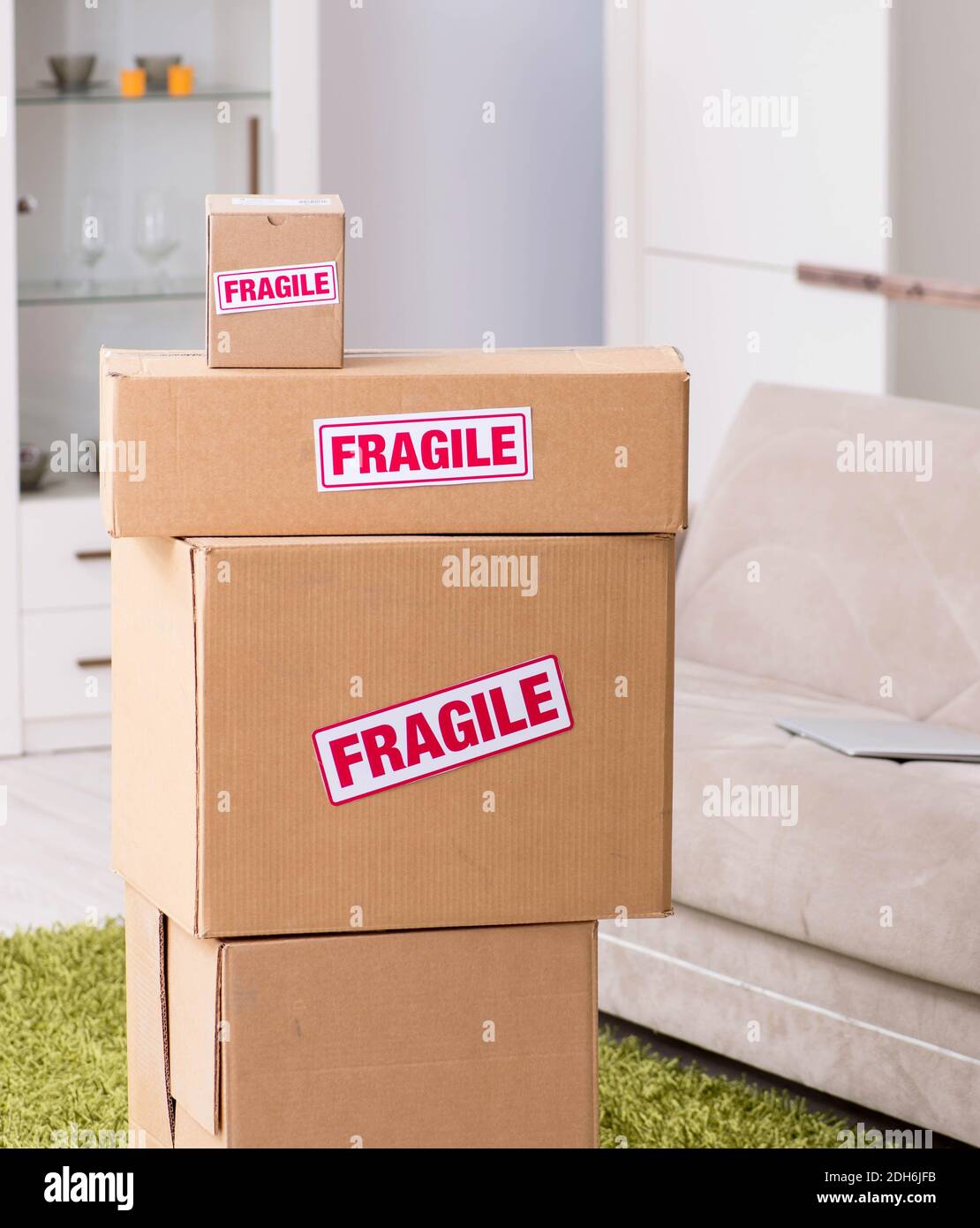 Transportation contractor with fragile boxes Stock Photo - Alamy