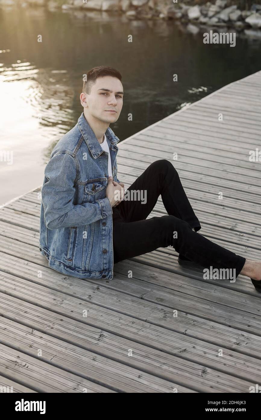 Guy resting on pier hi-res stock photography and images - Alamy