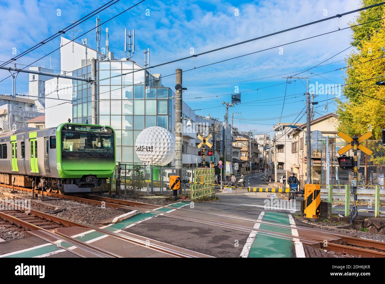 tokyo, japan - december 06 2020: Japan Rail train passing over the last ...