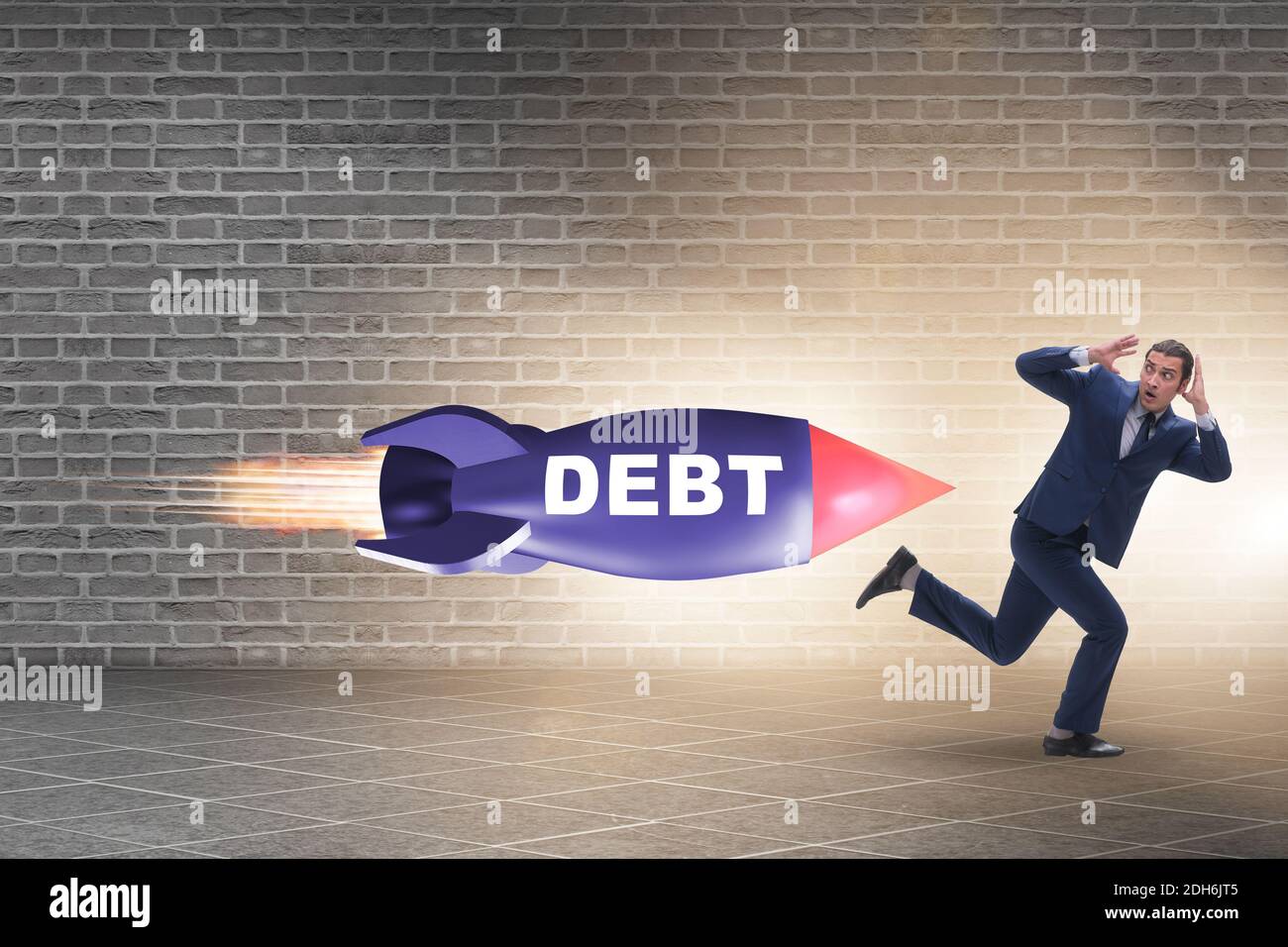 Concept of loan and debt with businessman chased by rocket Stock Photo ...