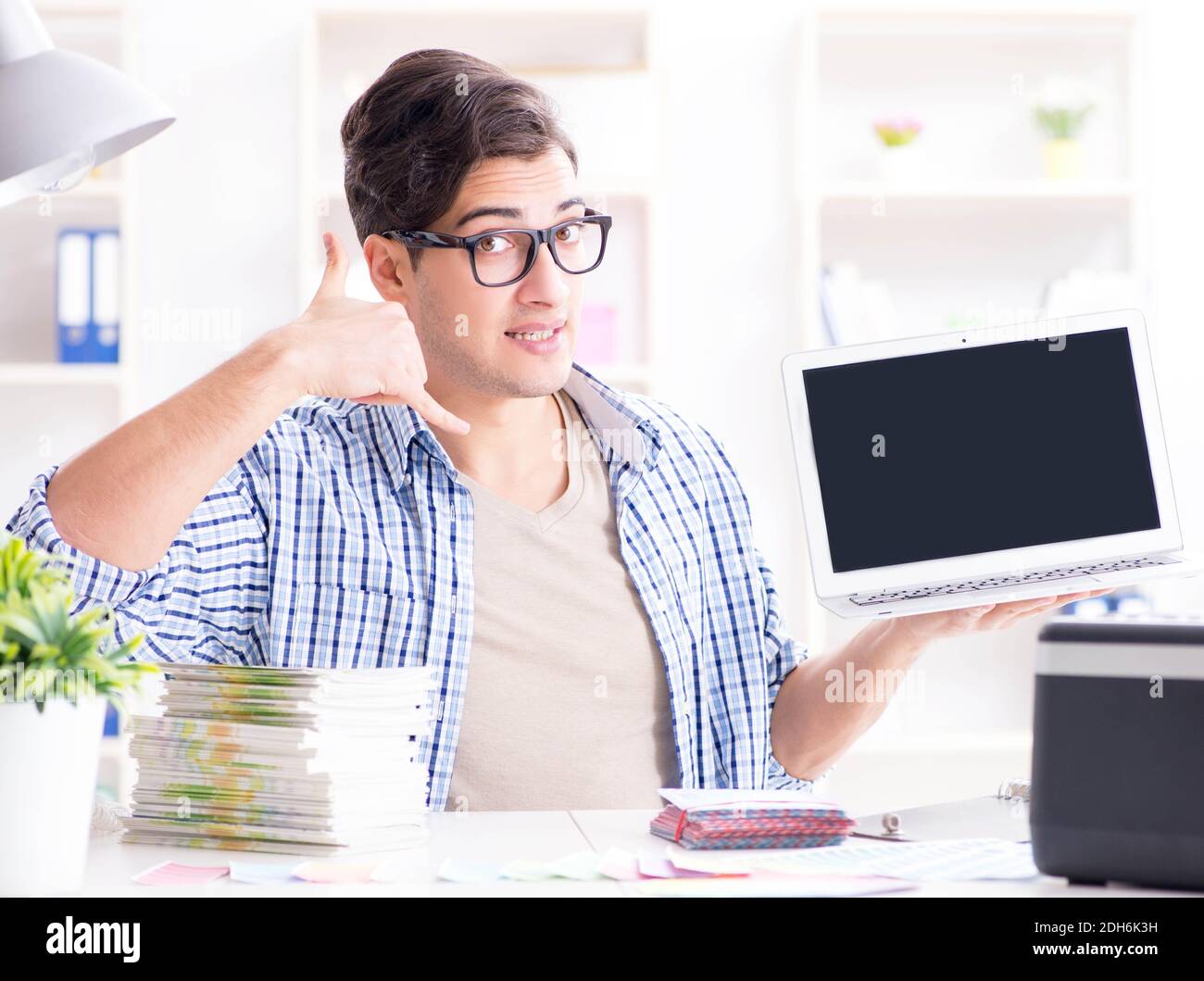 Young designer showing the presentation on computer Stock Photo - Alamy