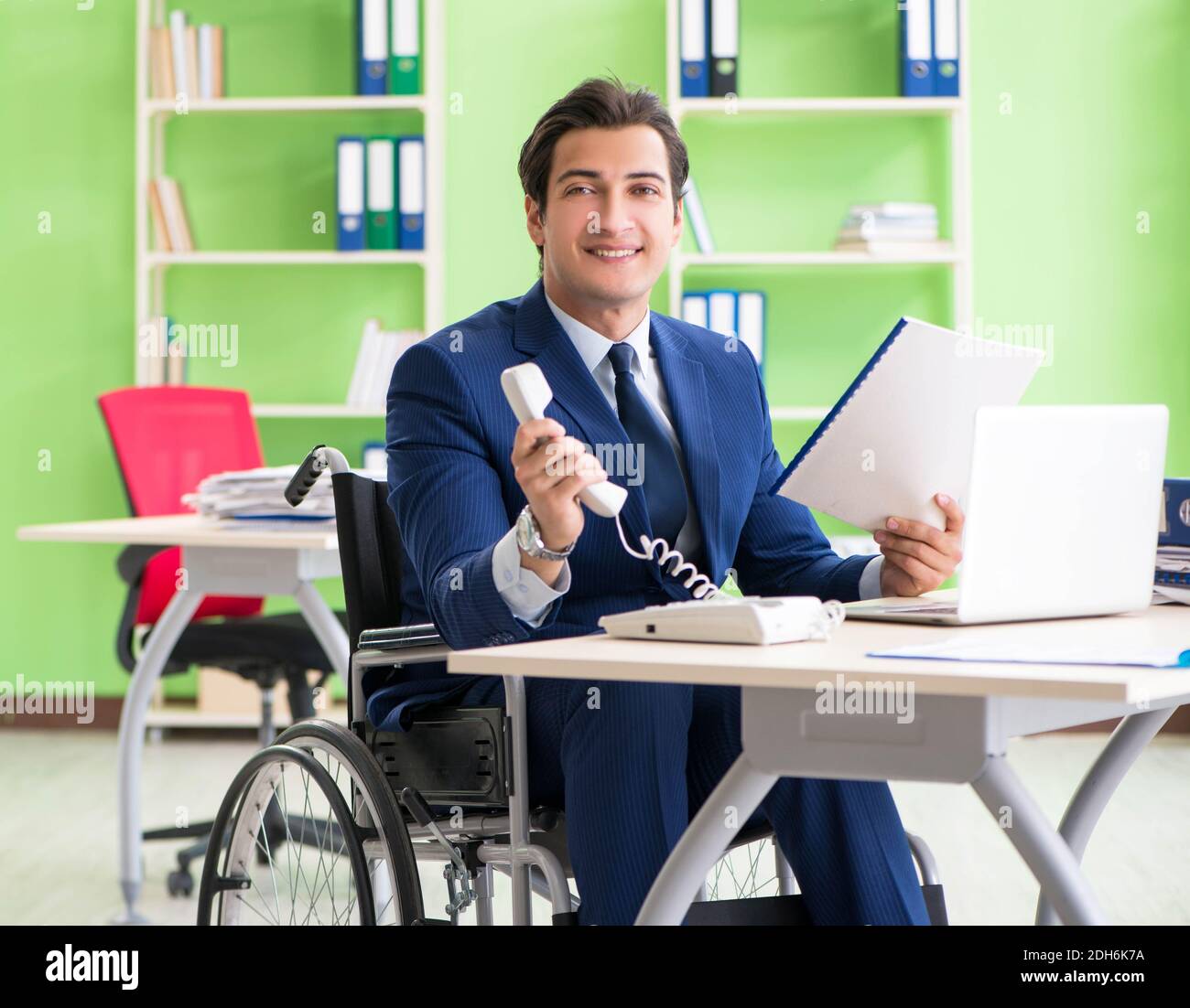 Disabled businessman working in the office Stock Photo - Alamy