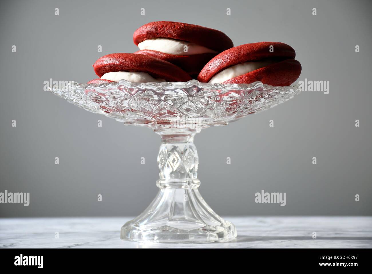 Food photography of red velvet moon pies in crystal dish eye level view ...