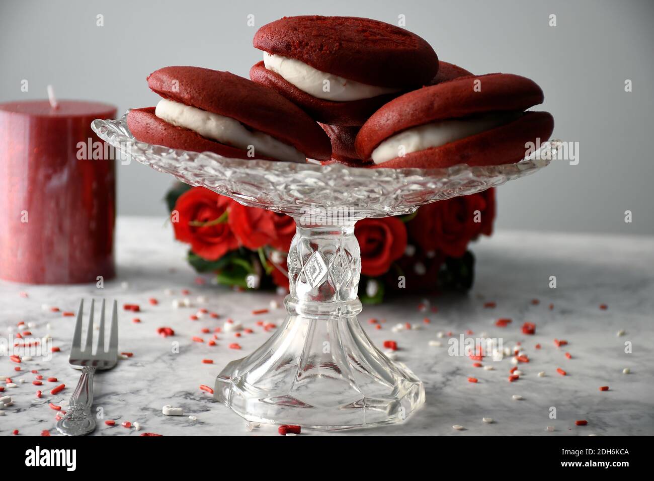 Food photography red velvet moon pies in crystal dish , roses and ...
