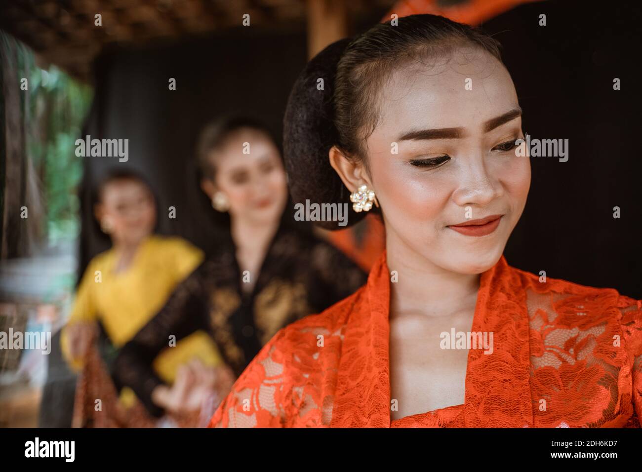portrait of three young women presenting traditional Javanese dance ...