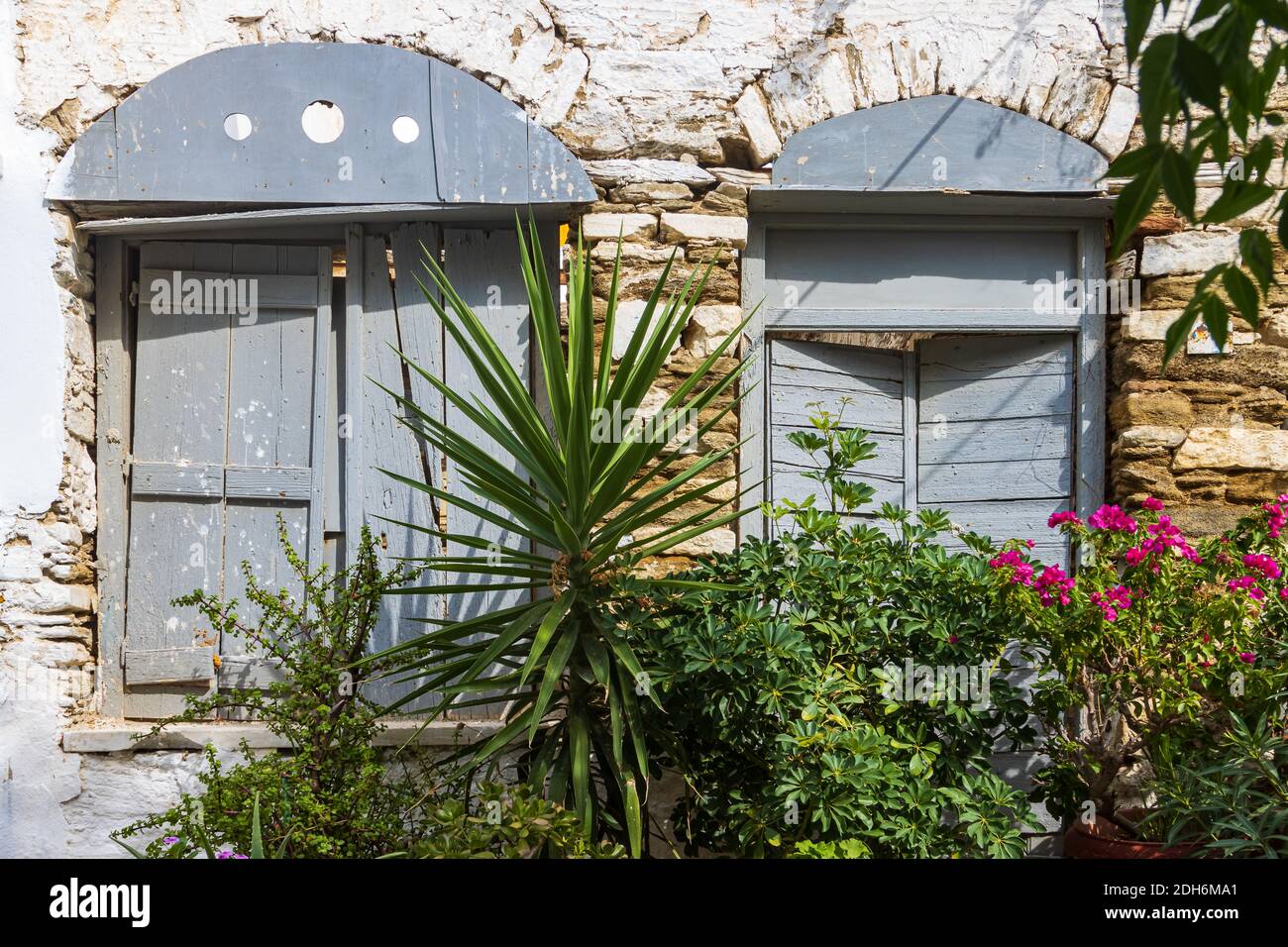 Window with flowers in the mountain village of Pirgos on the Greek ...