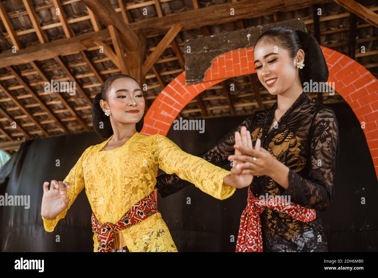 portrait young women presenting traditional Javanese dance movements ...
